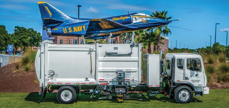 McNeilus Side Loader Garbage Trucks | AutoReach